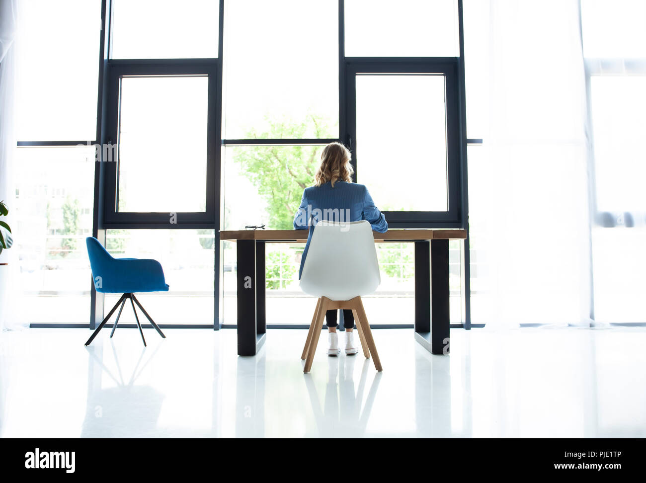 Busy employer. Beautiful business lady smiling while working in office ...