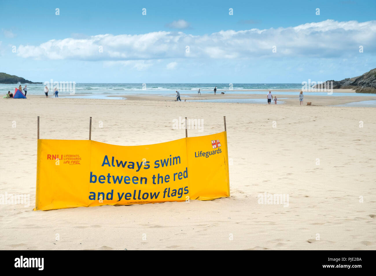 An RNLI safety advice banner on Crantock Beach in Newquay Cornwall ...
