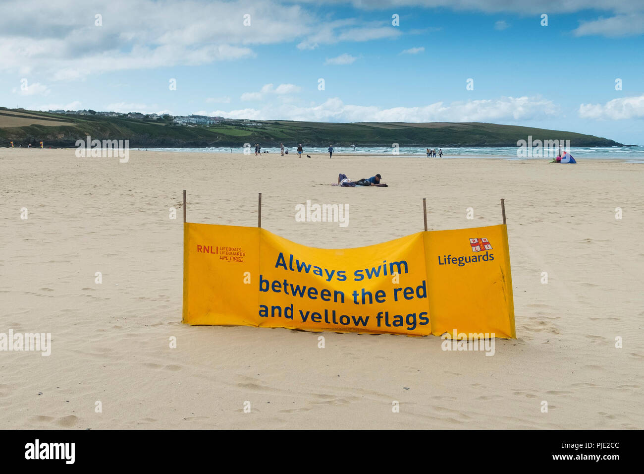 A RNLI safety advice banner on Crantock beach in Newquay Cornwall Stock ...