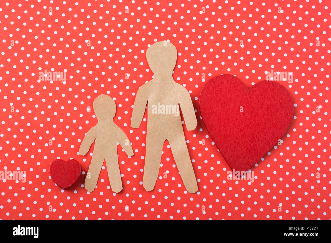 Man and child shape cut out of paper in the view Stock Photo - Alamy
