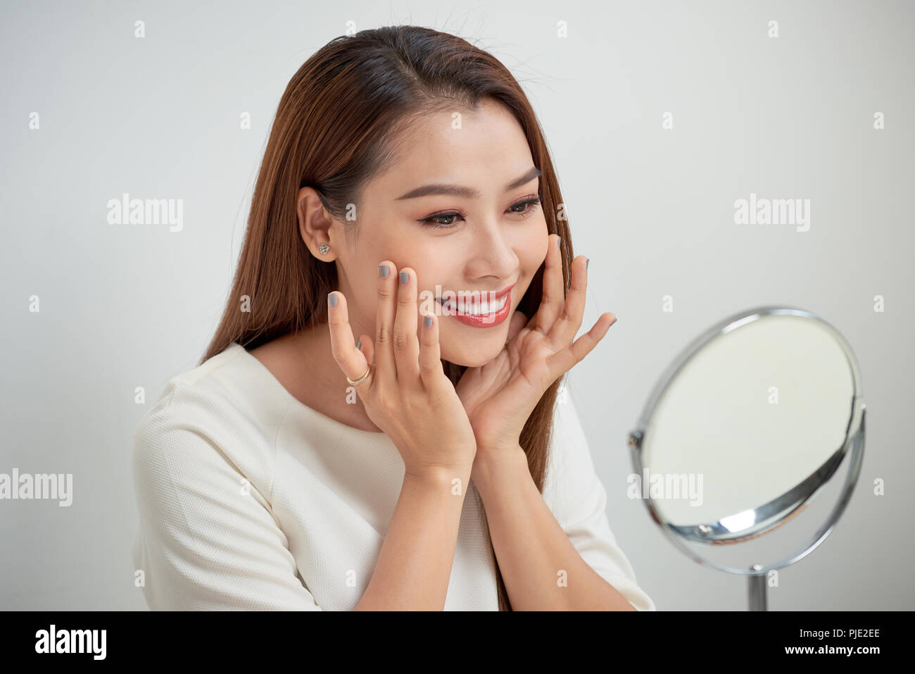 Woman looking mirror sad hi-res stock photography and images - Alamy