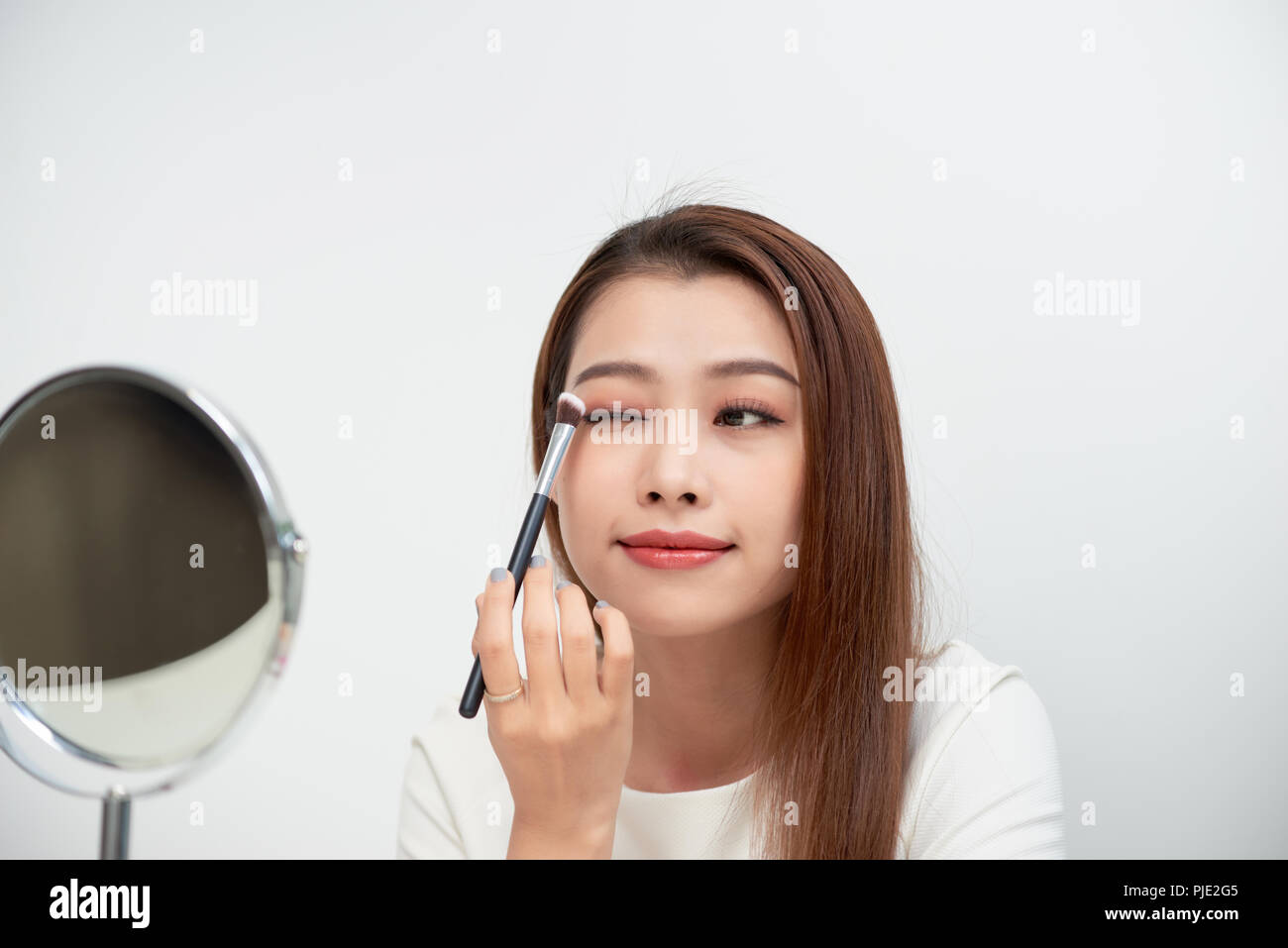 Close up of beautiful face of asian young woman getting make-up. Asian ...