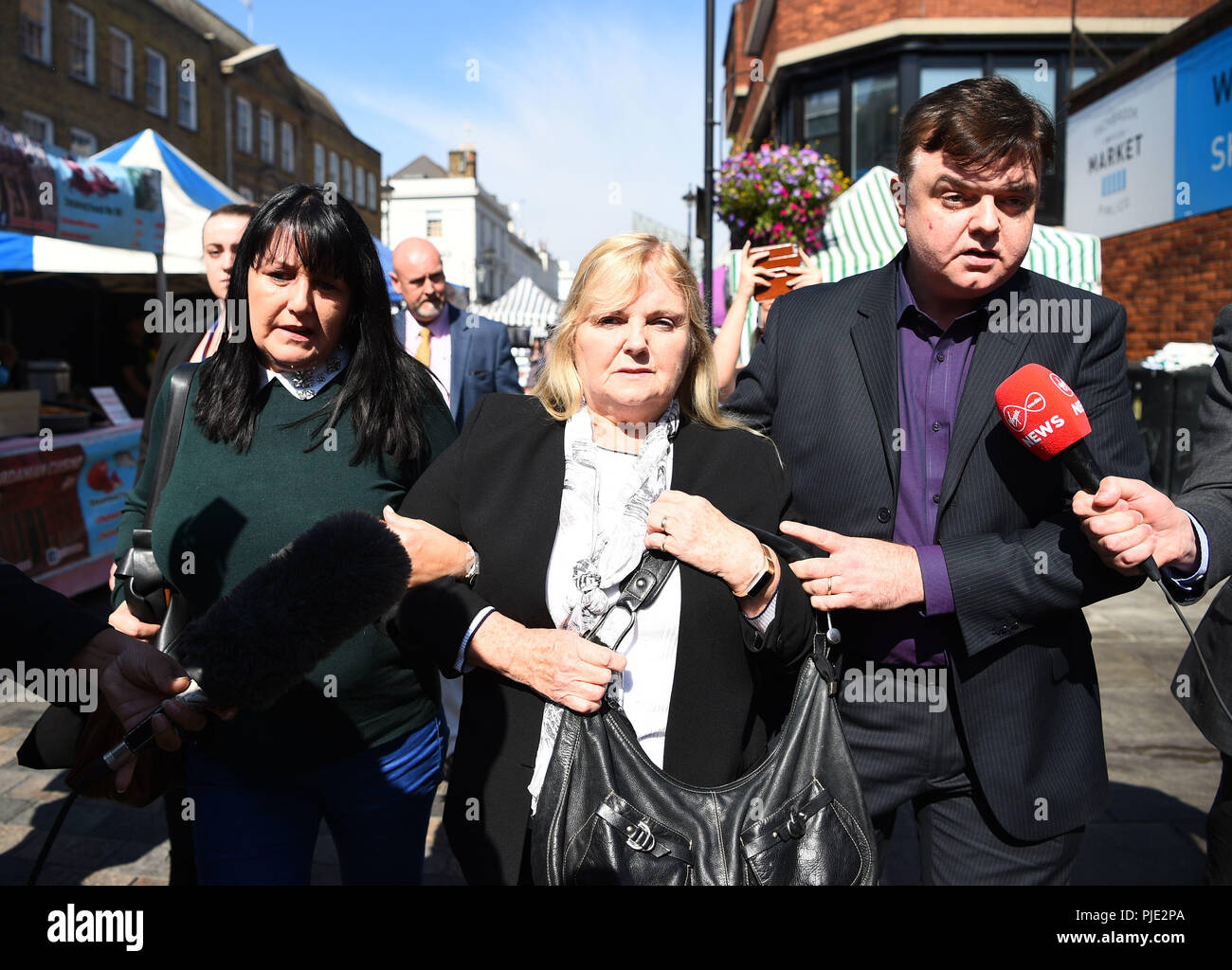 Mother Eileen O'Riordan (centre) leaving Westminster Coroner's Court ...