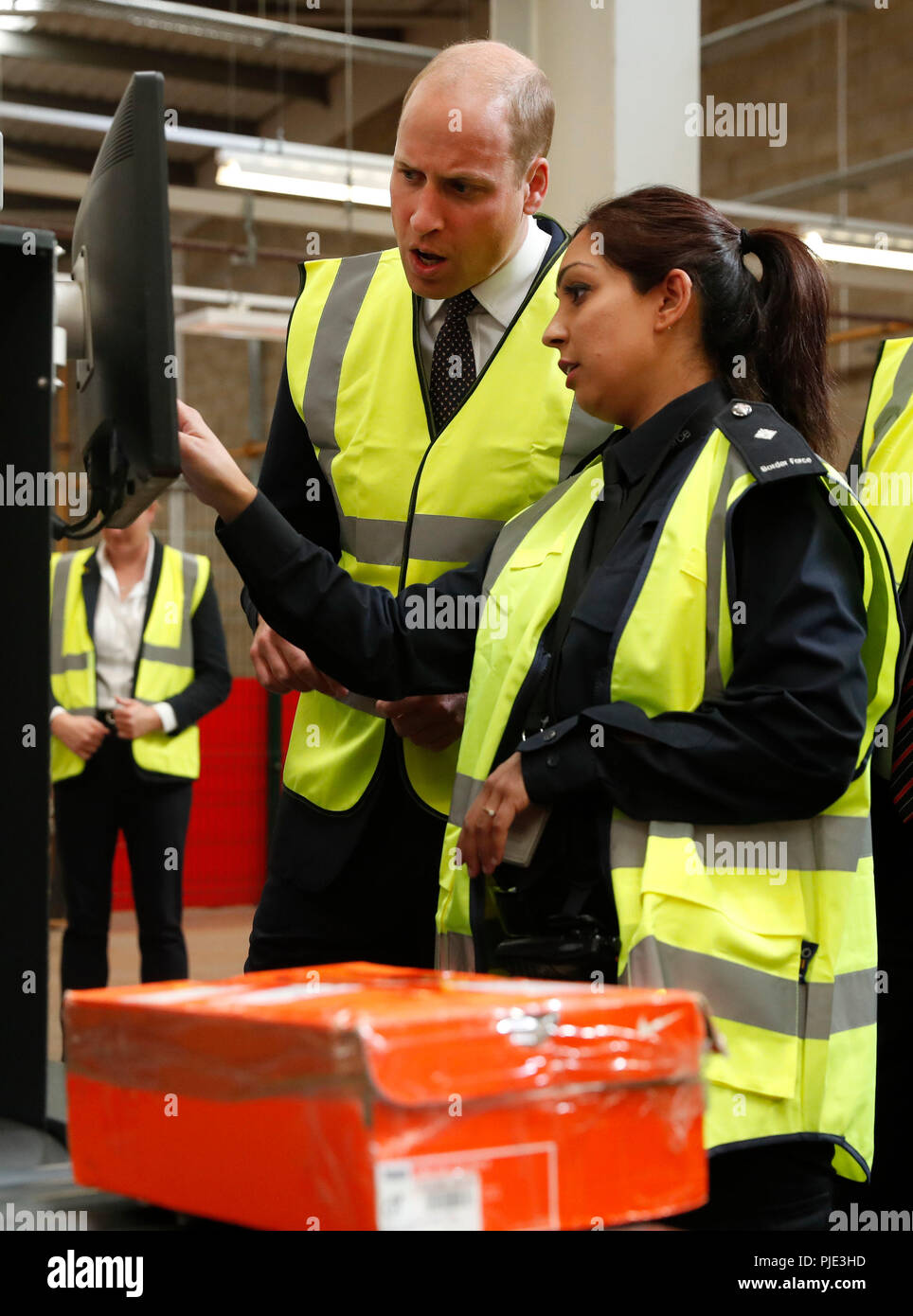 Uk border force officer scans hi-res stock photography and images - Alamy