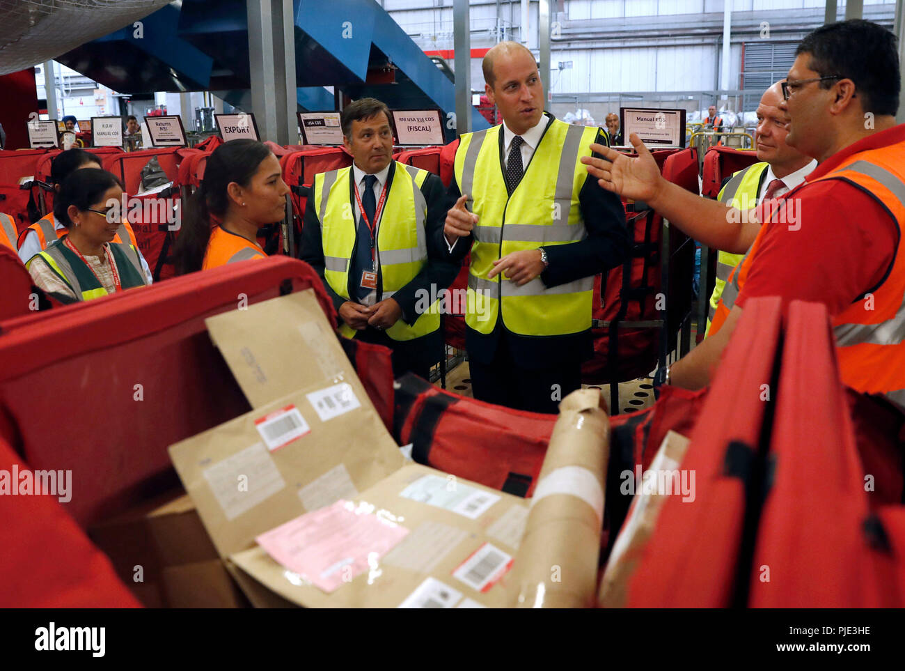 The Duke of Cambridge talks to Royal Mail sorting office workers at the ...