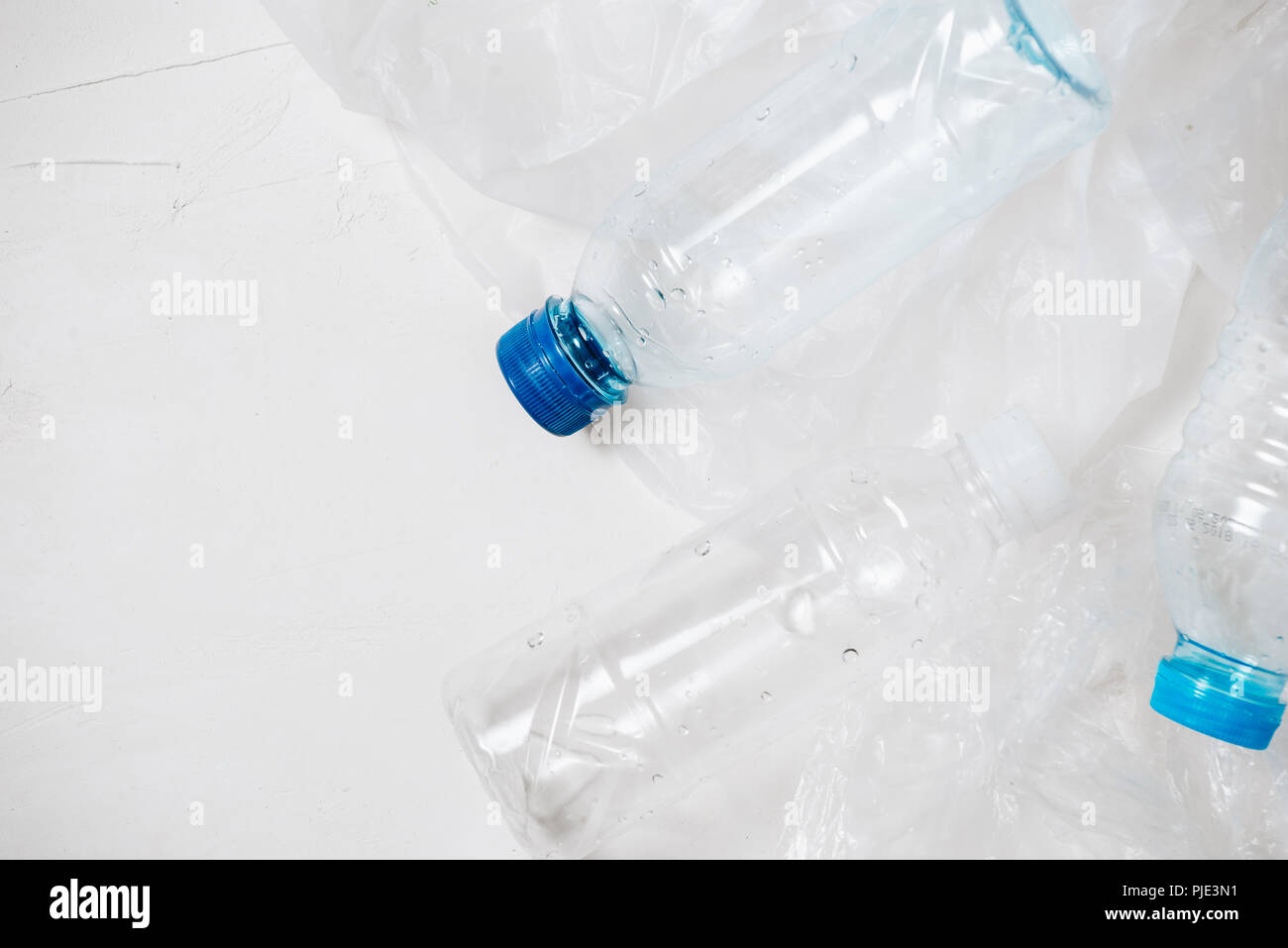 plastic bottles stack to recycle on white background Stock Photo - Alamy