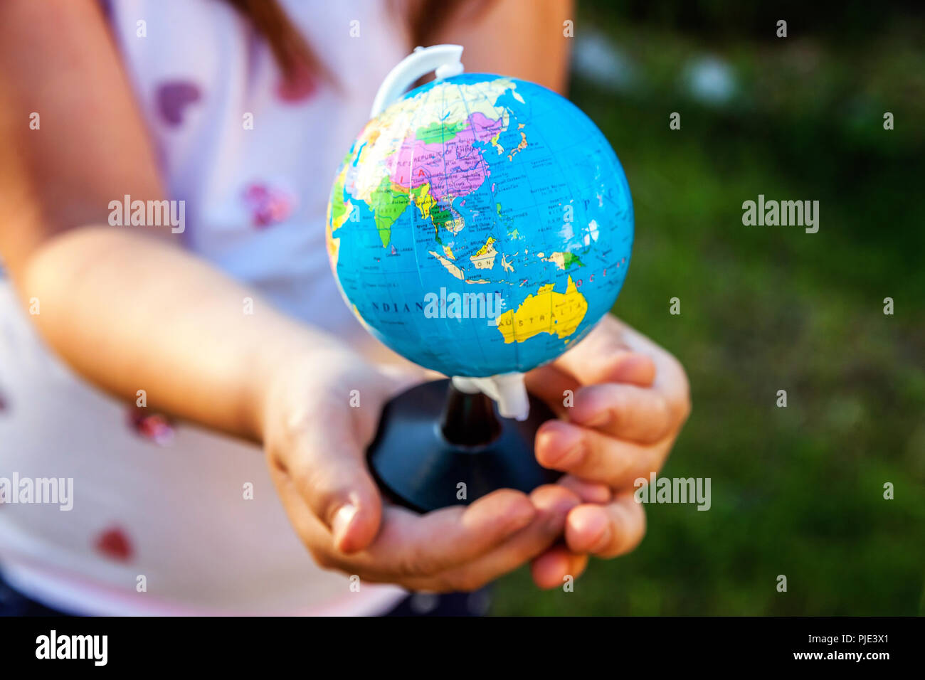 Earth globe in children hands. Little girl holding symbol world map ...