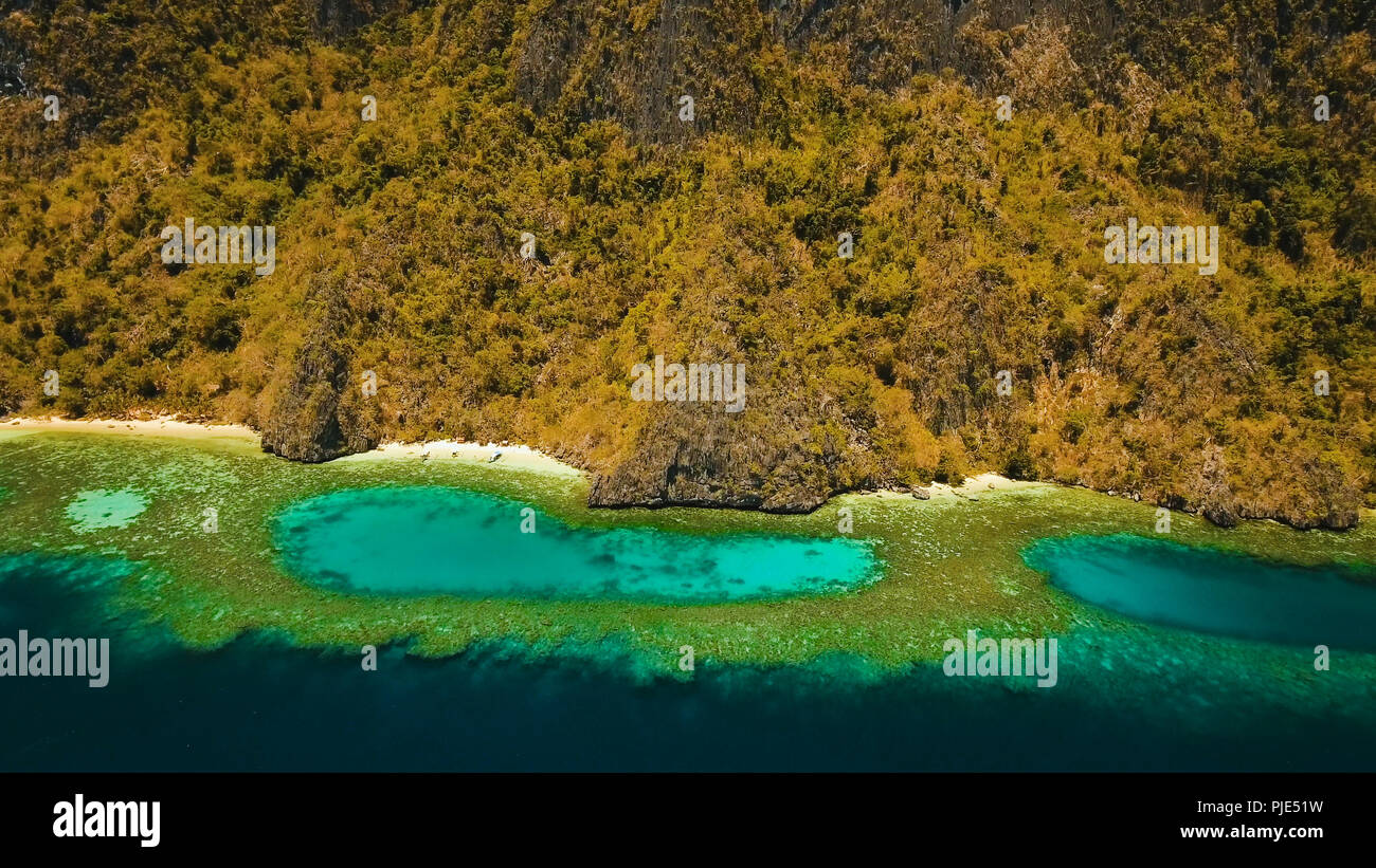 Aerial view: Lagoon with blue, azure water in the middle of small ...
