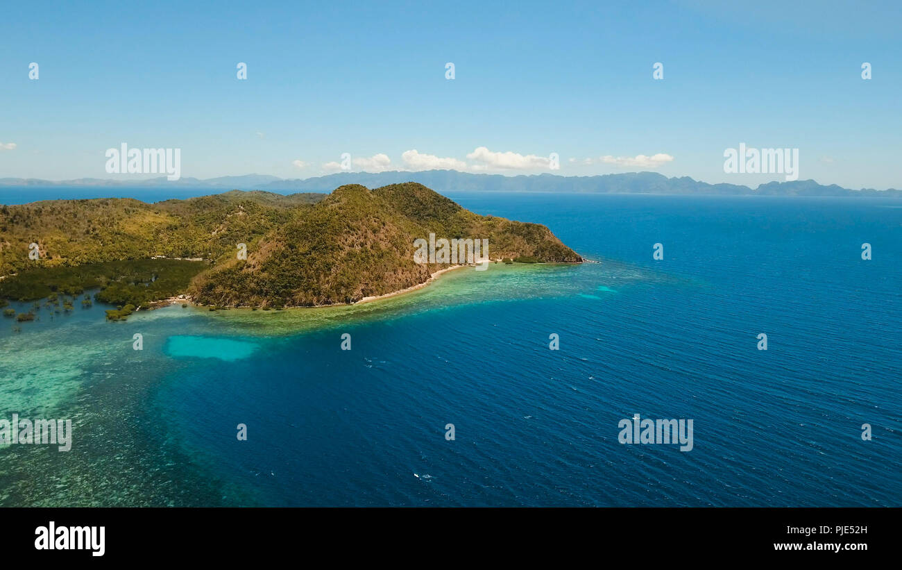 Aerial view: Lagoon with blue, azure water in the middle of small ...