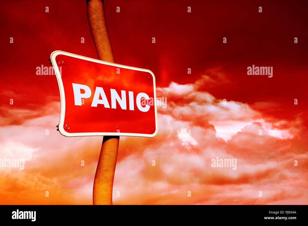 Panic sign against a red sky Stock Photo - Alamy