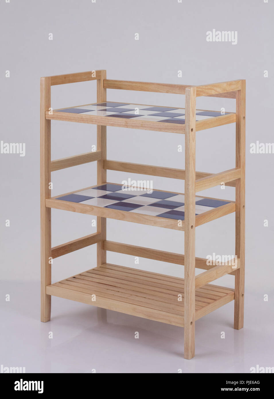 wooden shelf decorated with tiles isolated on white background Stock ...