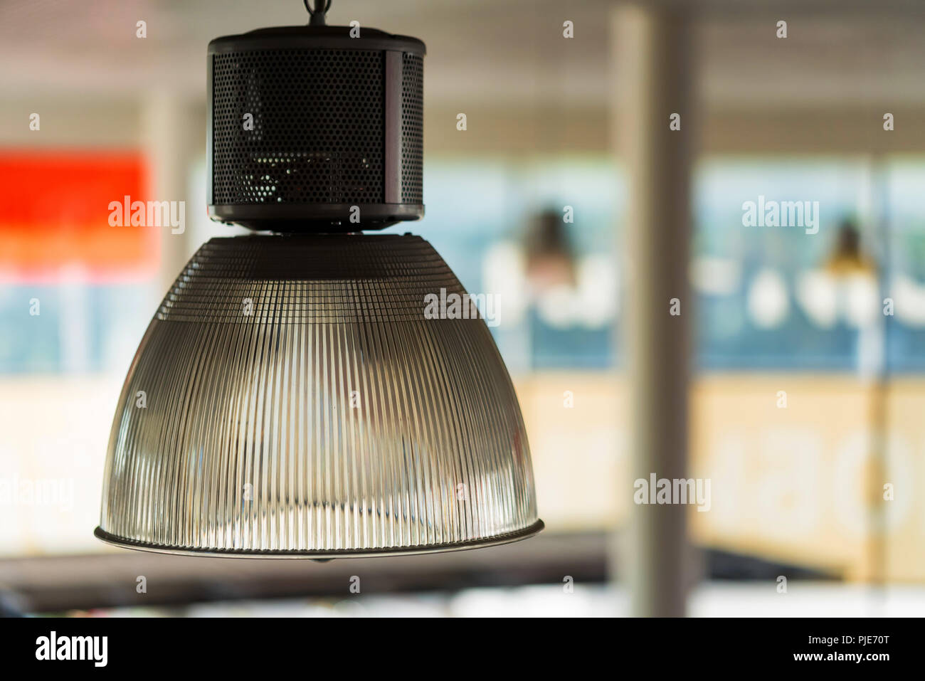 Modern lamp shade on office ceiling close Stock Photo - Alamy