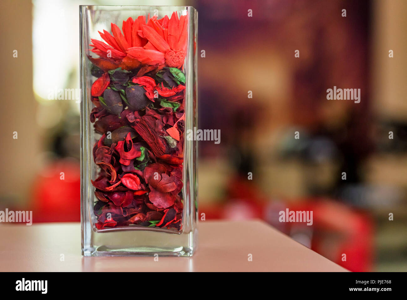 Interior glass vase with dry red plants inside Stock Photo - Alamy