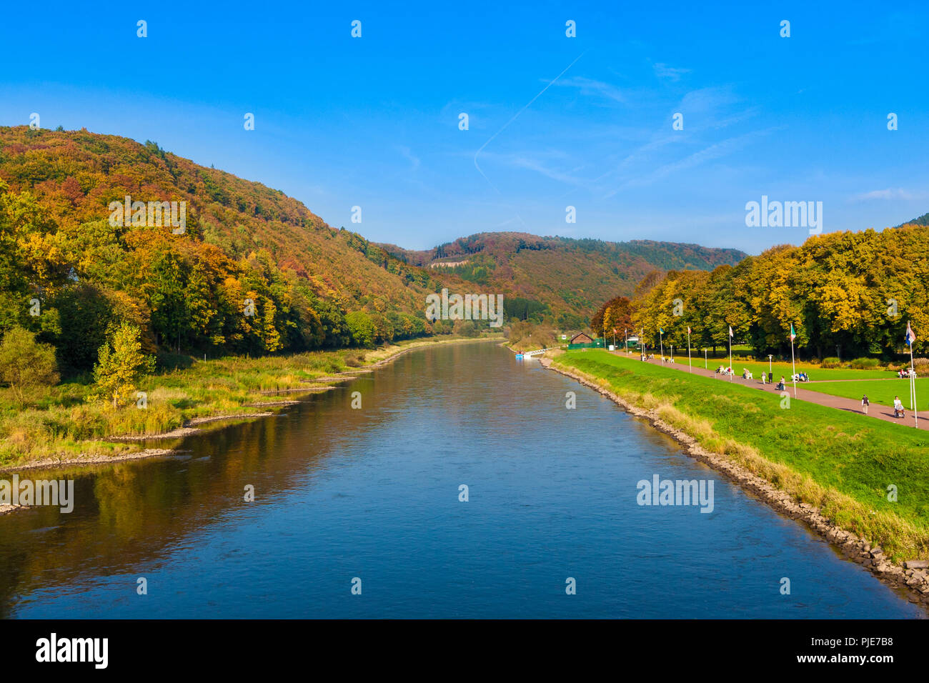 Beautiful scenery of the river Weser in autumn with the colourful trees ...