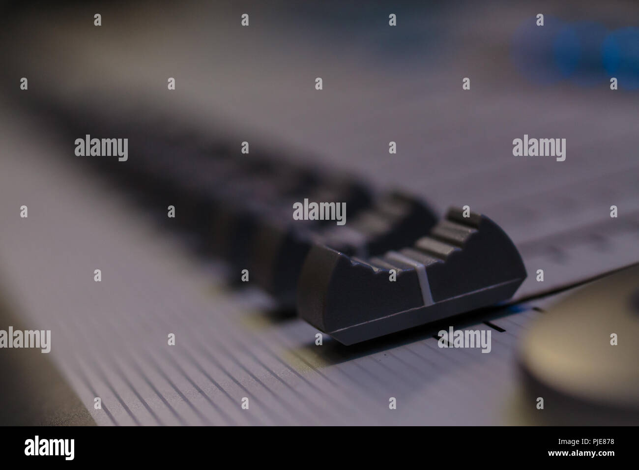 Professional Audio Sound Mixing Console Faders, white desk and black ...