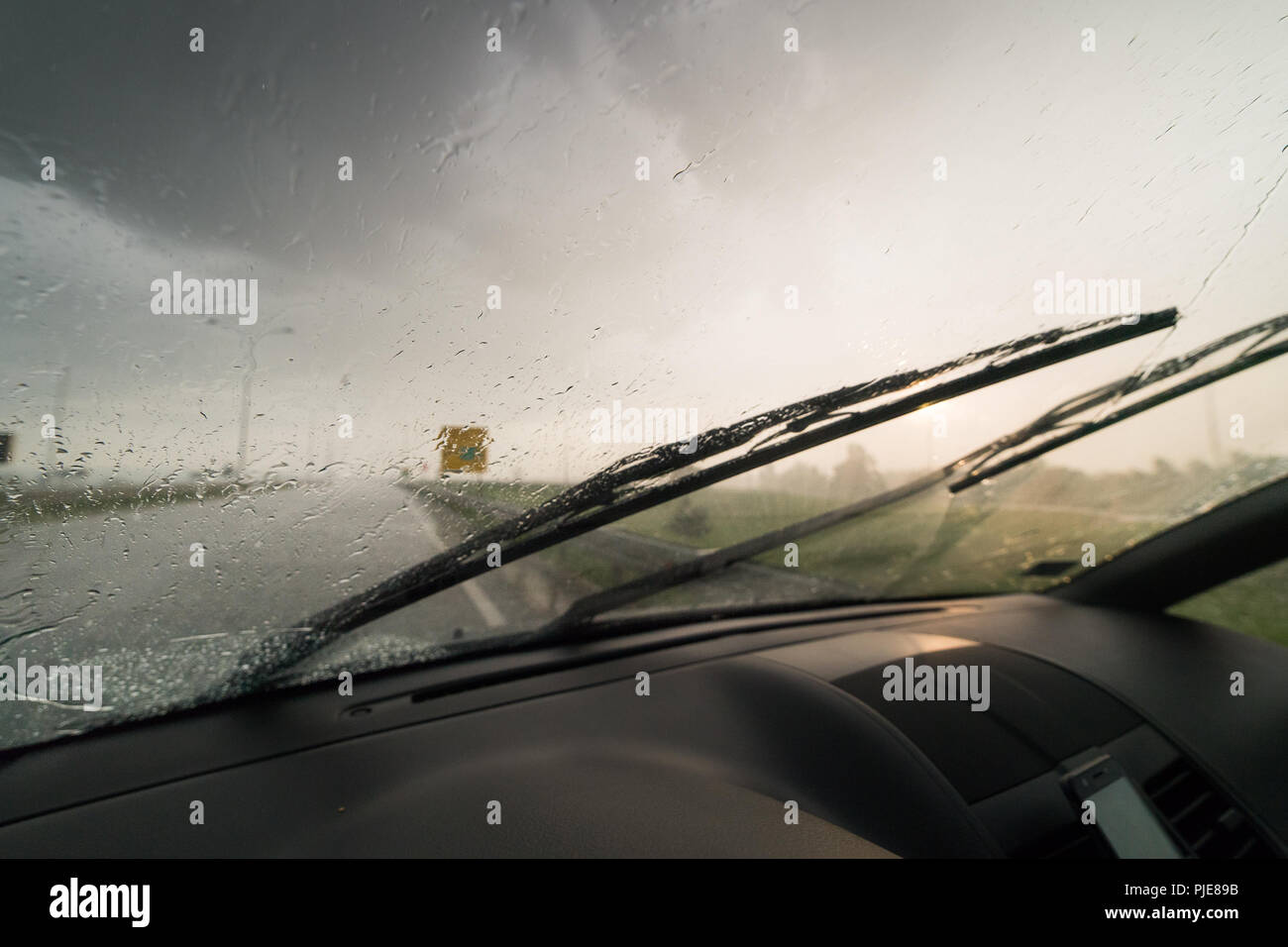 Windshield wipers from inside of car in the rainy day Stock Photo - Alamy