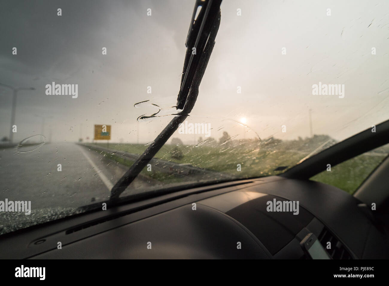 Windshield wipers from inside of car in the rainy day Stock Photo - Alamy