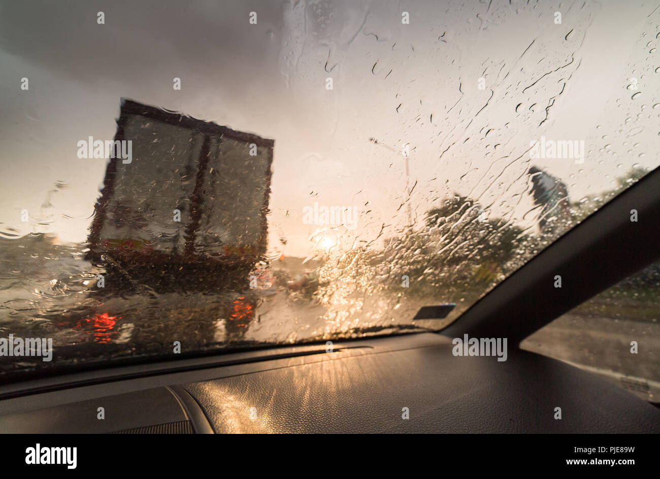 Windshield wipers from inside of car in the rainy day Stock Photo - Alamy