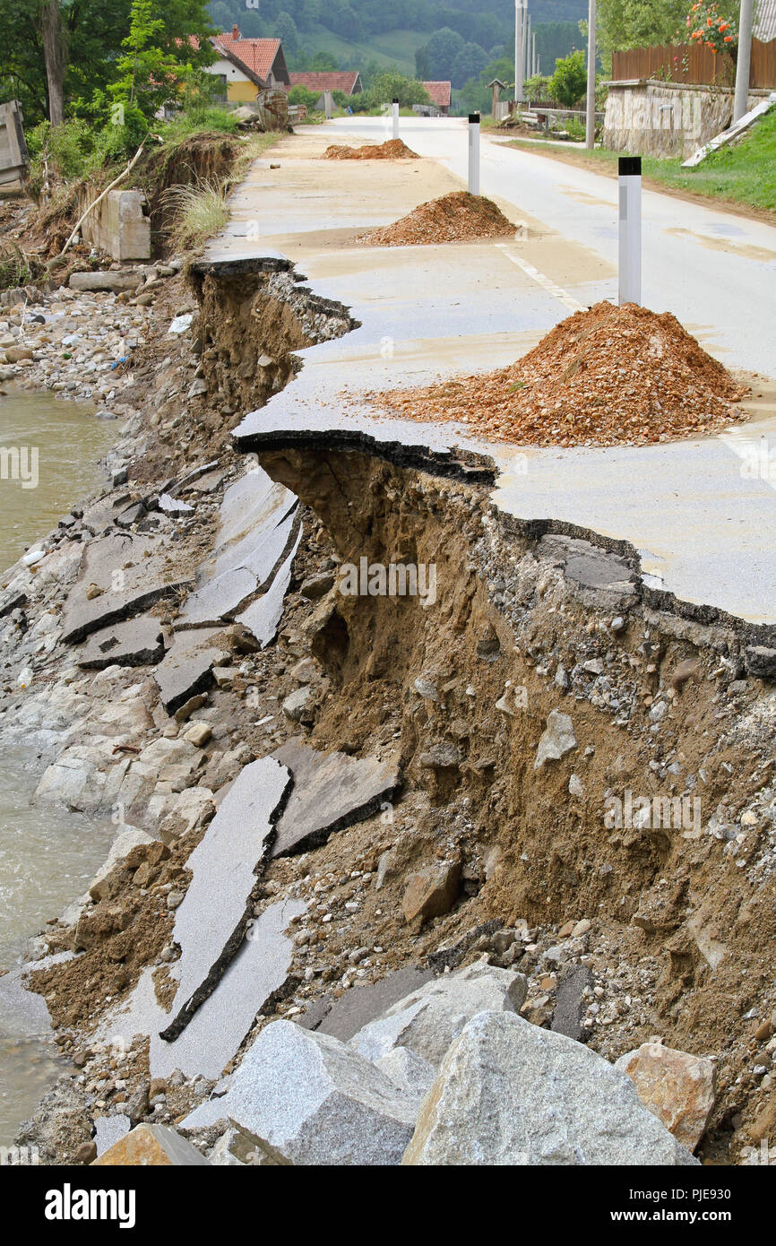 Destroyed road landslide damaged in powerful flood Stock Photo - Alamy