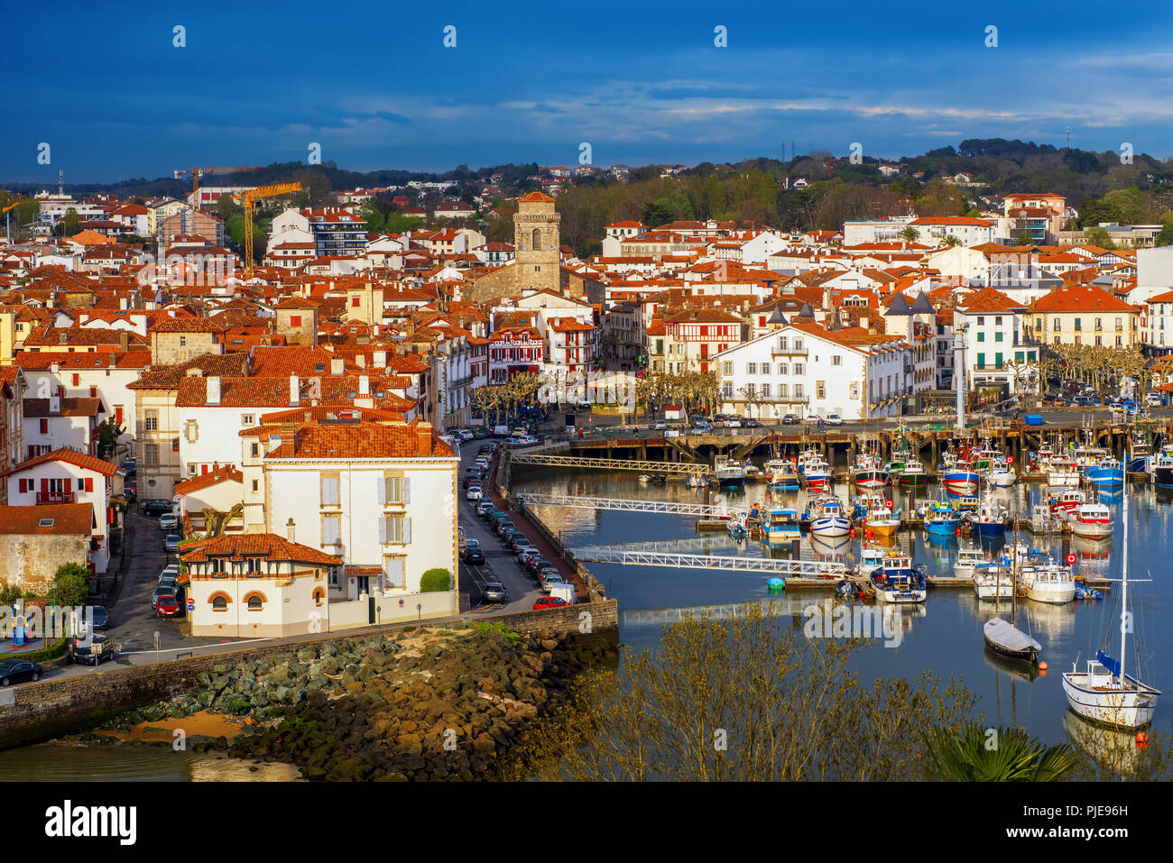 Traditional red and white basque houses in the Old Town of Saint Jean ...