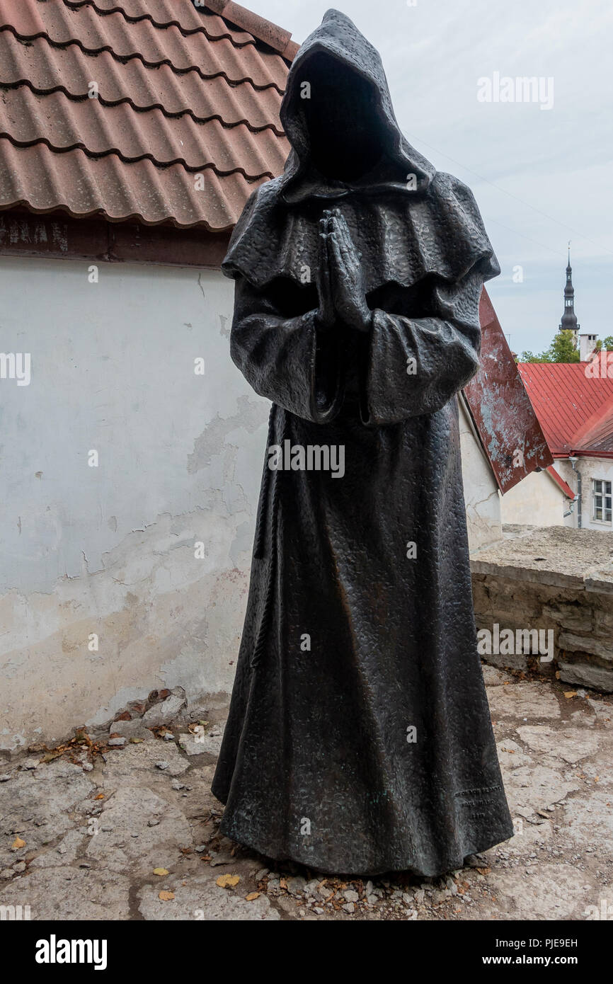 Black metal statue of a faceless monk in Tallinn Stock Photo - Alamy
