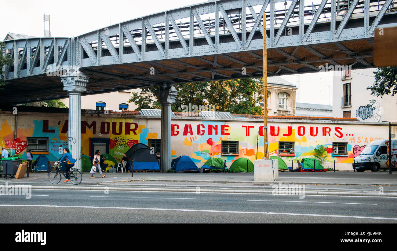 Paris, France - Sept 6, 2018: Immigrants living in tents under a bridge ...