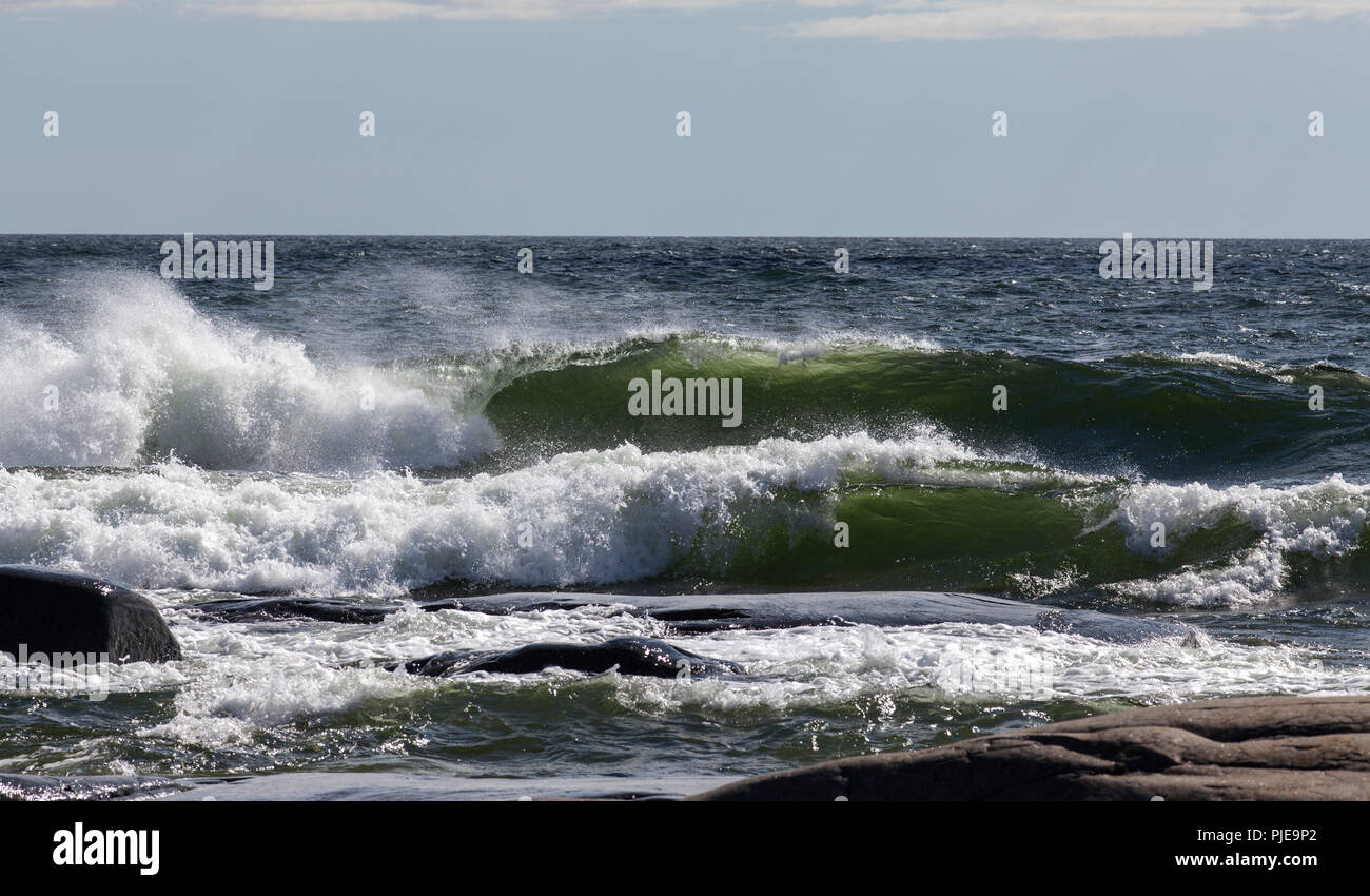 Strong foamy waves hit rocks hi-res stock photography and images - Alamy