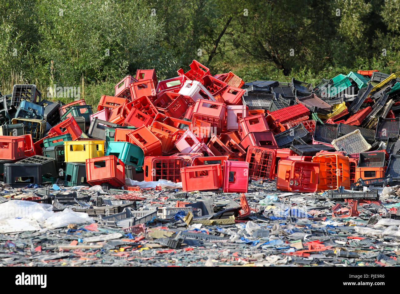 Plastic crates at scrap yard waiting for recycling Stock Photo - Alamy