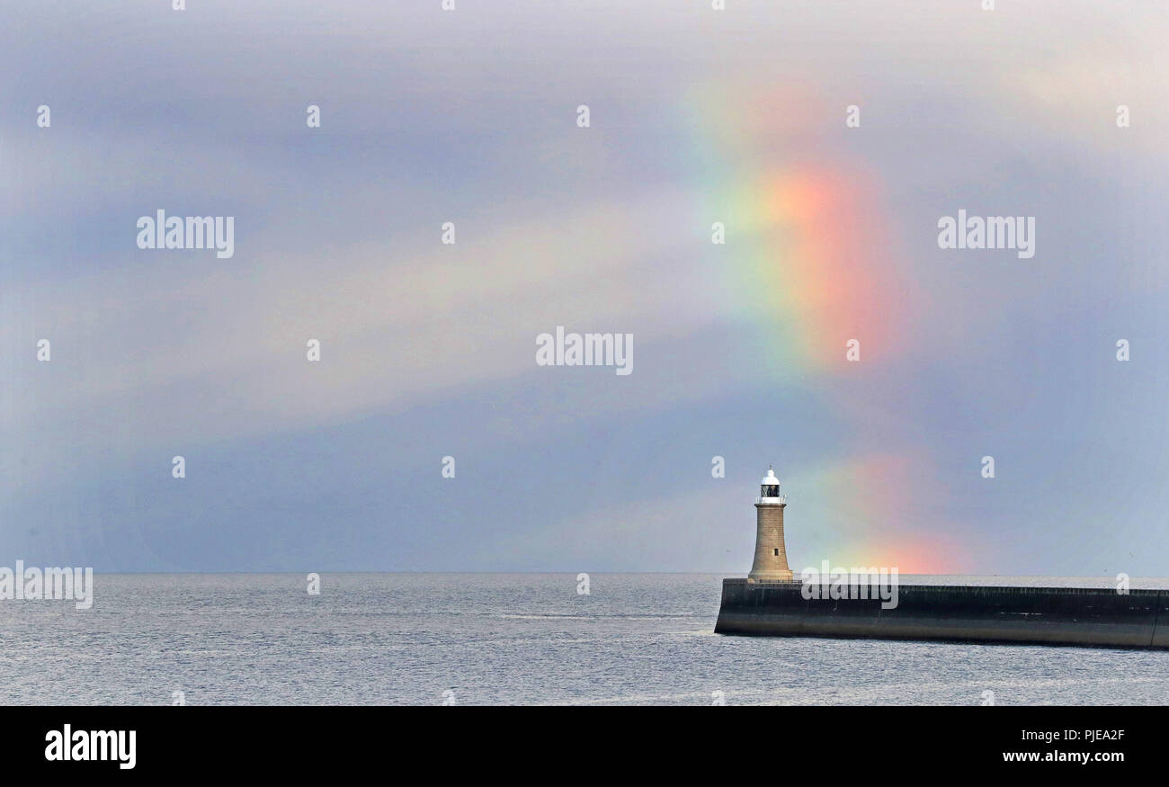 A rainbow over Tynemouth lighthouse in Northumberland Stock Photo - Alamy