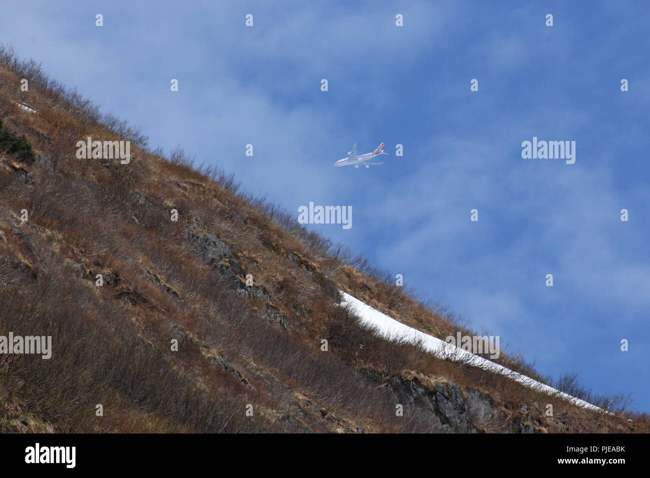 A jumbo jet viewed on approach to Anchorage from the Kenai peninsula ...