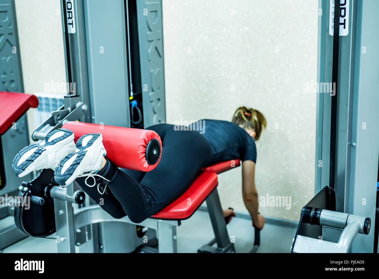 Woman lie back lifting leg hi-res stock photography and images - Alamy