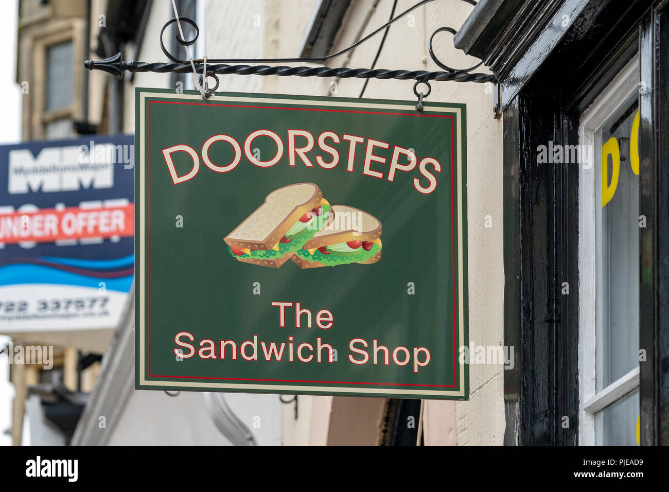 Doorsteps sandwich shop sign Stock Photo - Alamy