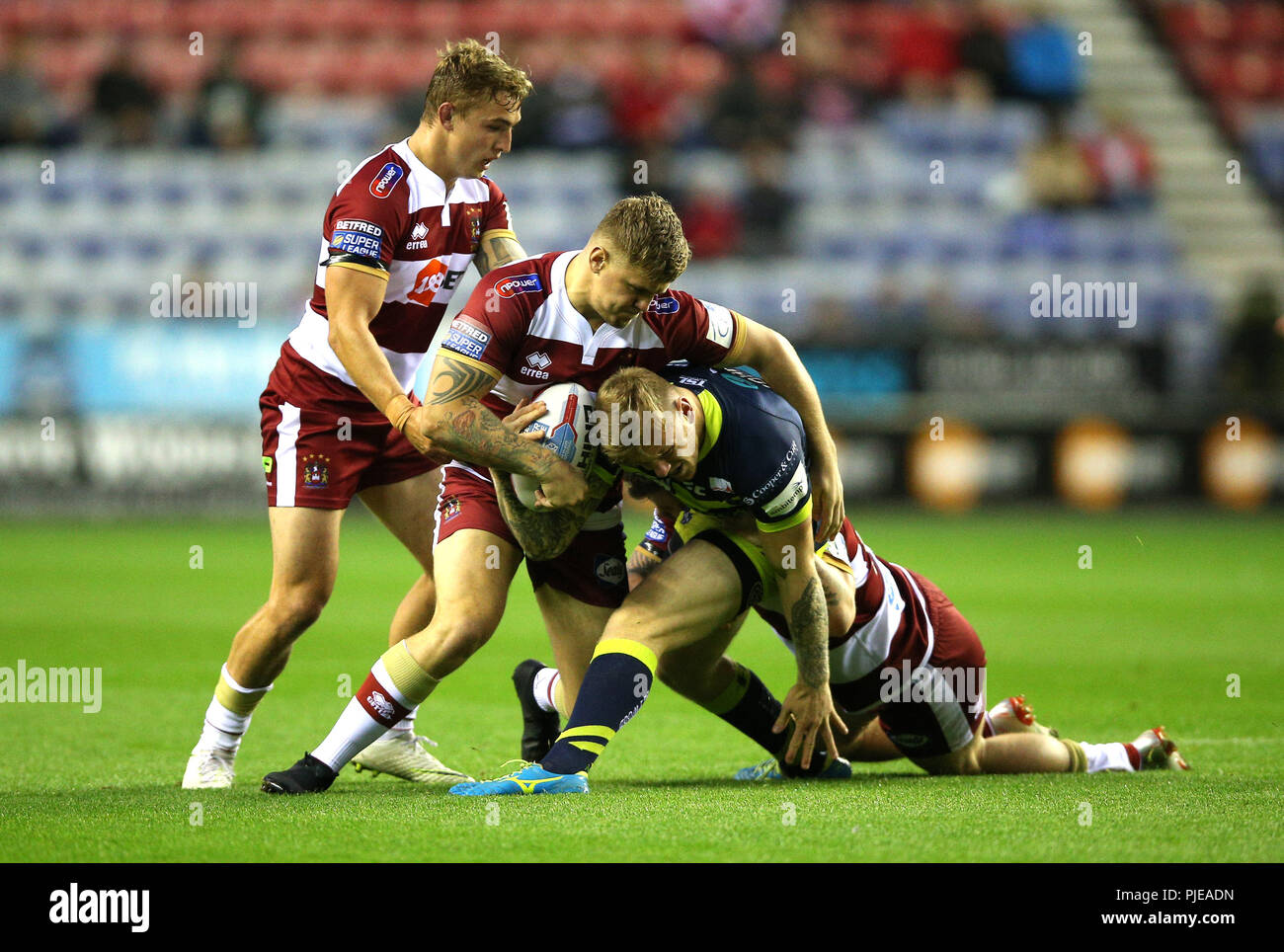 Wigan Warriors Ryan Sutton (left) and John Bateman (right) tackle ...