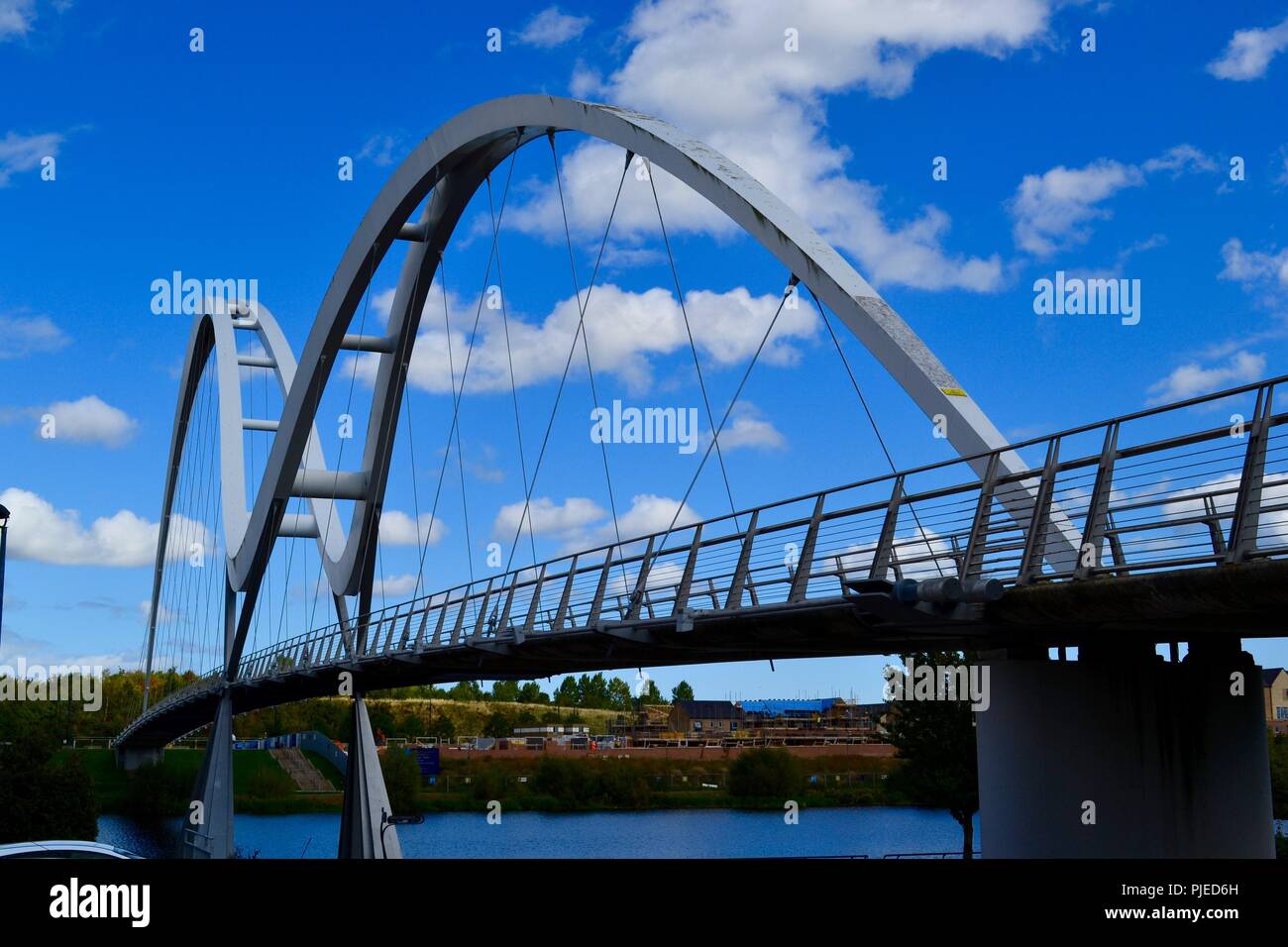 Striking, naturally lit image of the iconic Infinity Bridge spanning ...