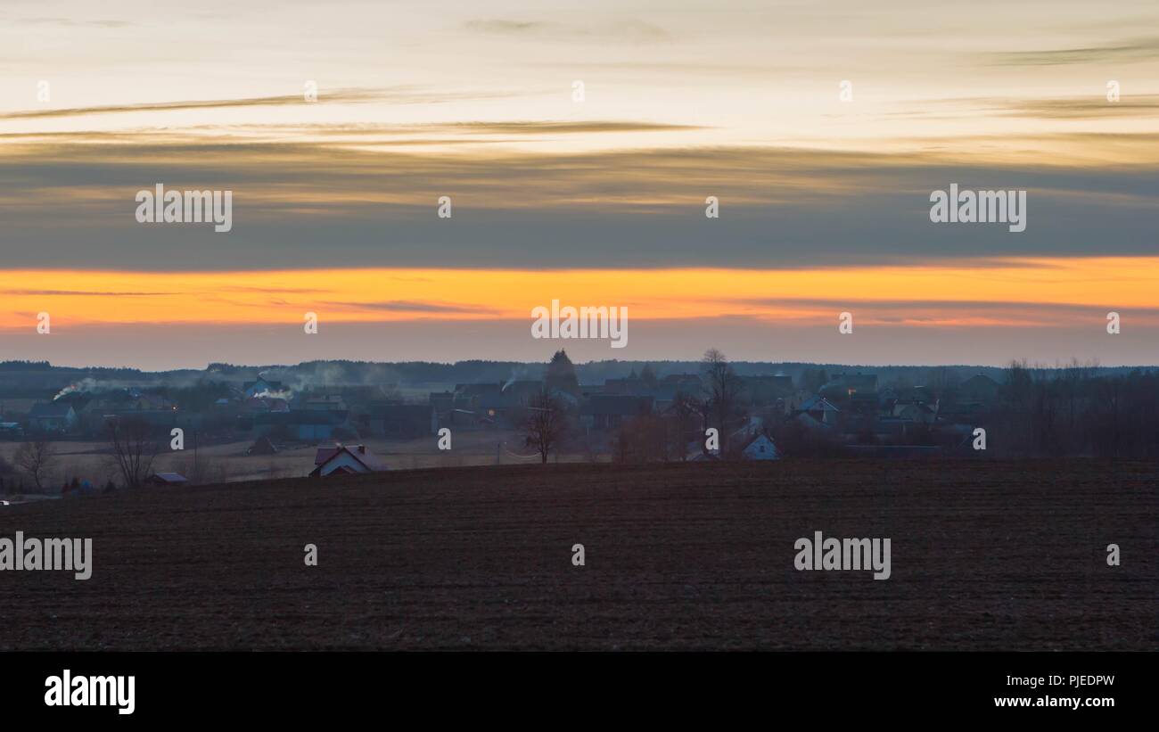 Late evening sky over village near fields. Rural landscape Stock Photo ...