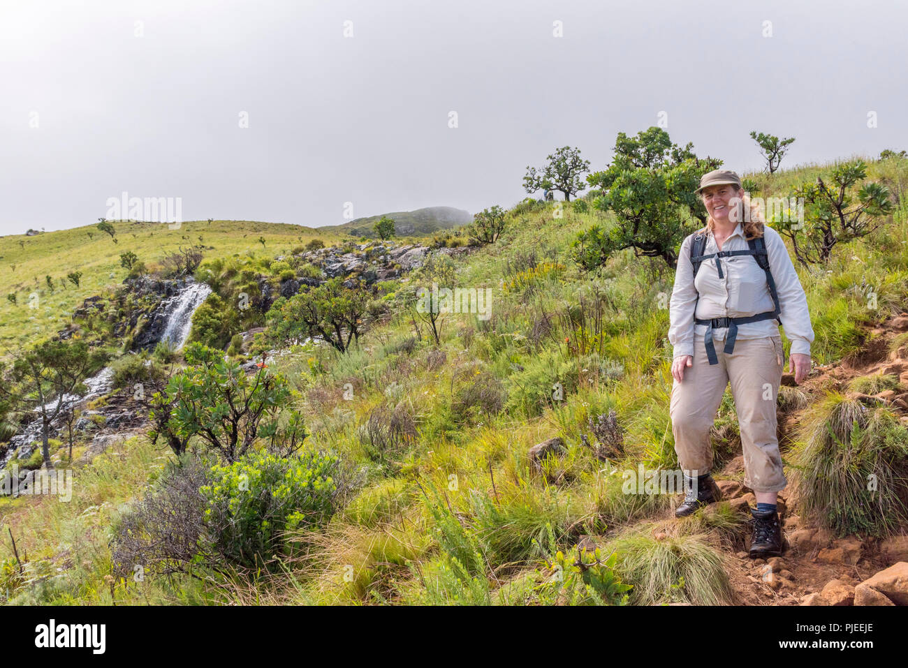 A hikers climbs the slopes of Mt Inyangani in Zimbabwe's Rhodes Nyanga ...