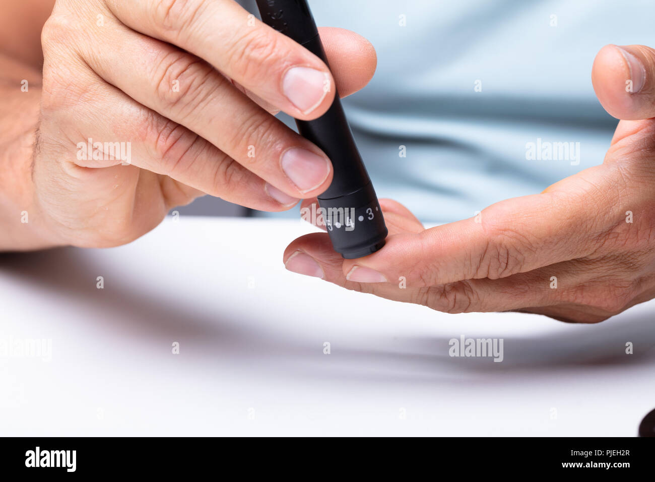 Close-up Of A Man's Hand Testing High Blood Sugar With Glucometer Stock ...
