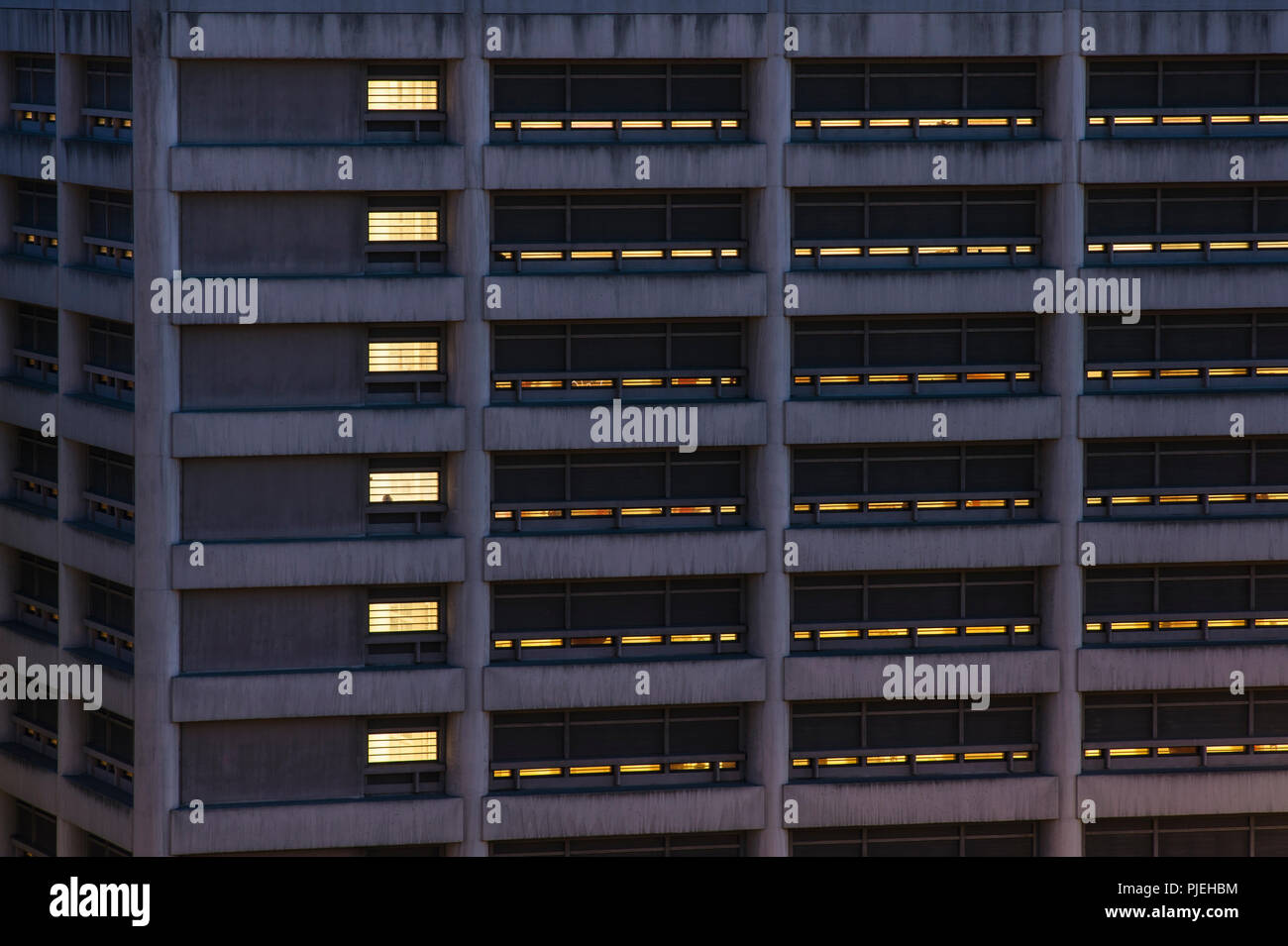 Downtown Seattle courthouse jail exterior with rows of light at sunset ...