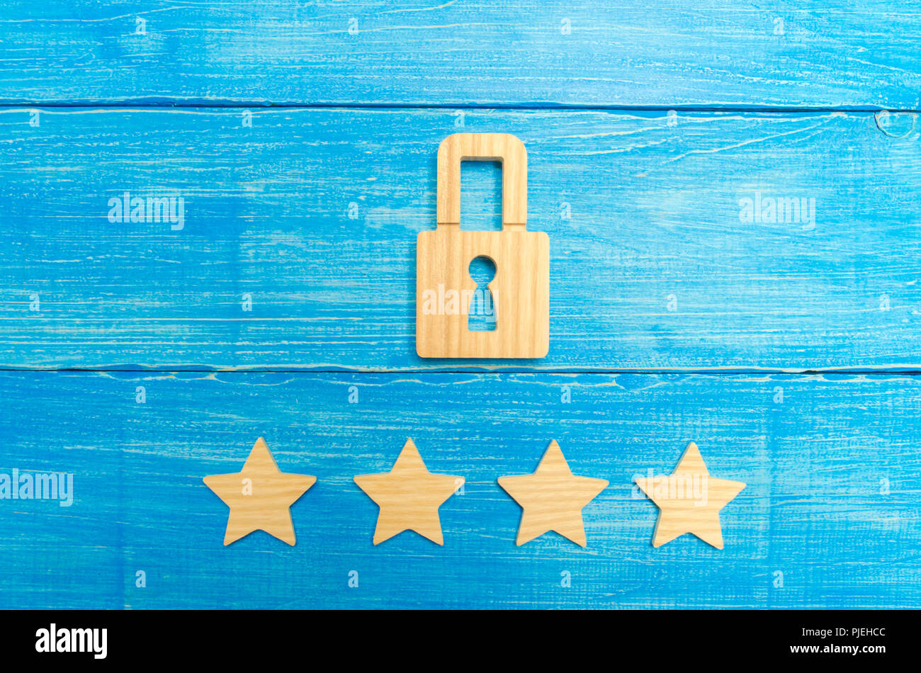 Wooden padlocks and four stars. Security, security of users and ...