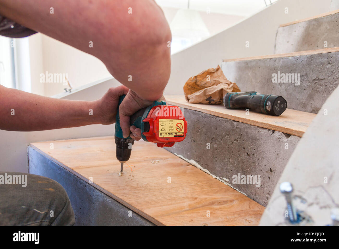 Production and installation of flax. Work of the master Stock Photo - Alamy