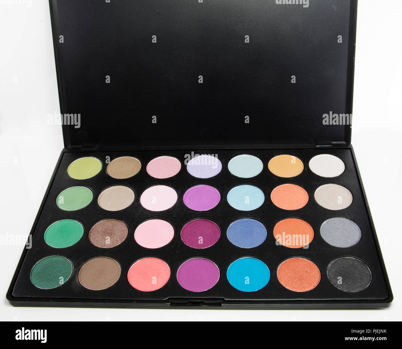 Multicolored circular make up pallet container isolated on white ...