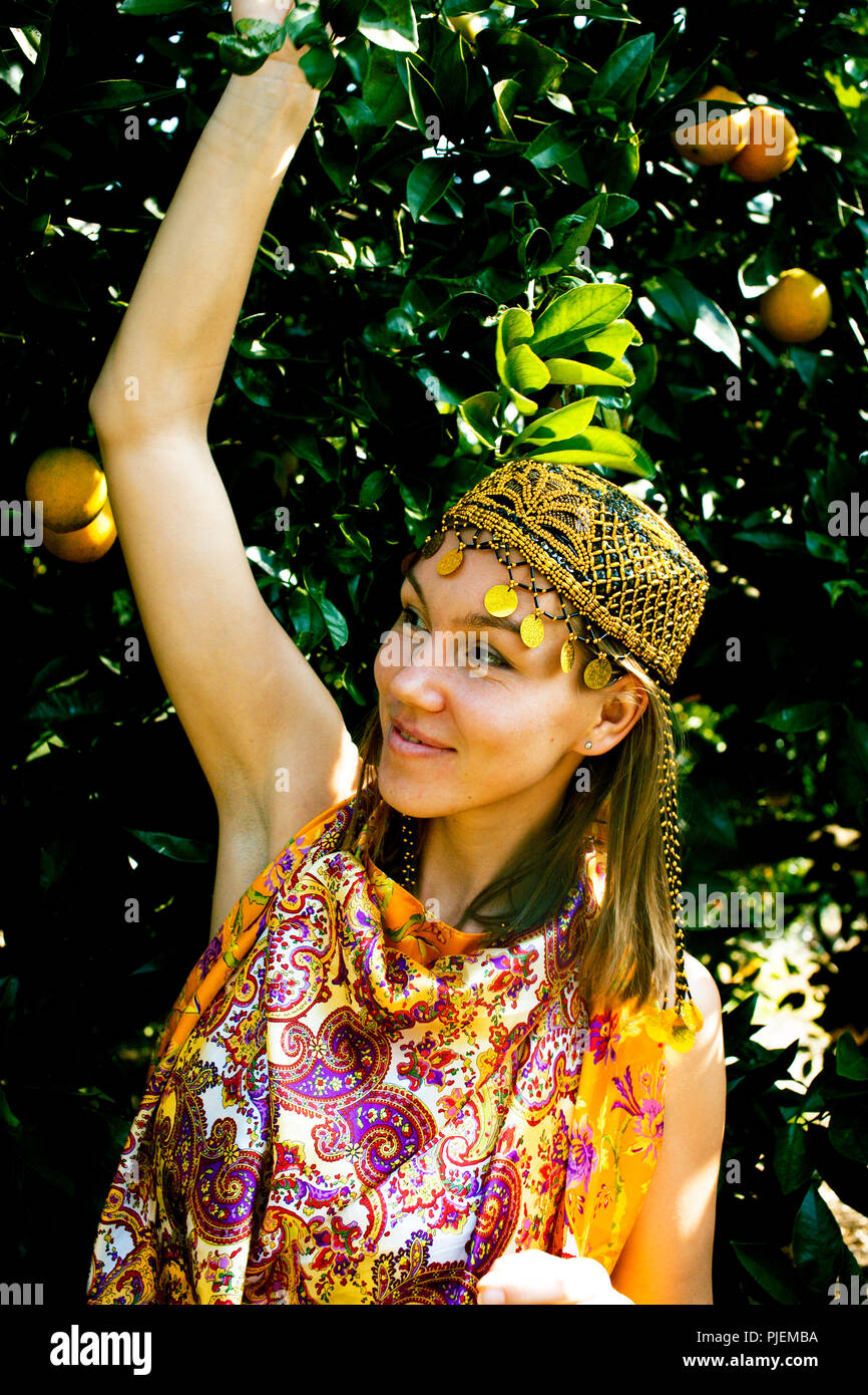 pretty islam woman in orange grove smiling, real muslim girl che Stock ...
