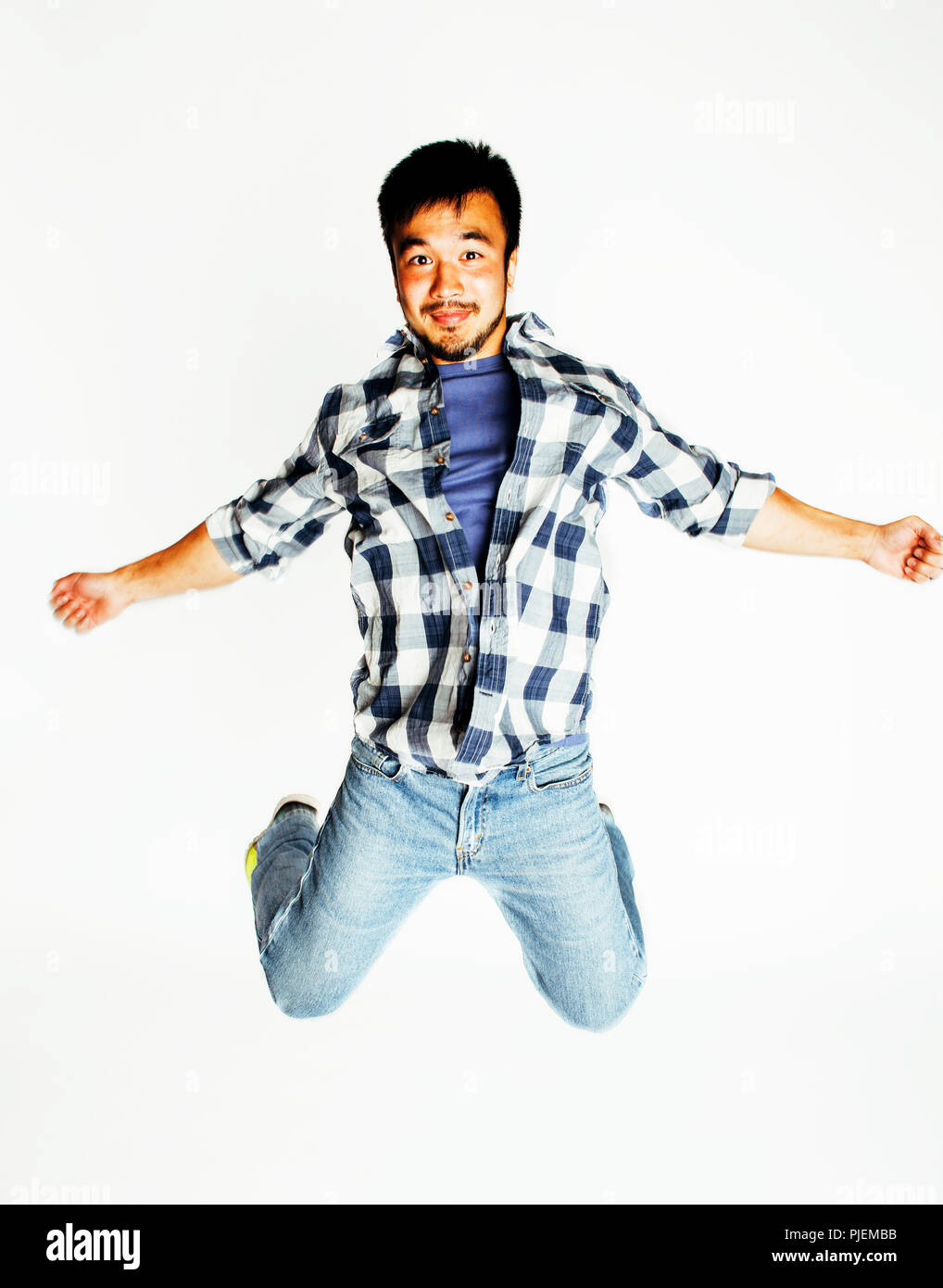 young pretty asian man jumping cheerful against white background Stock ...