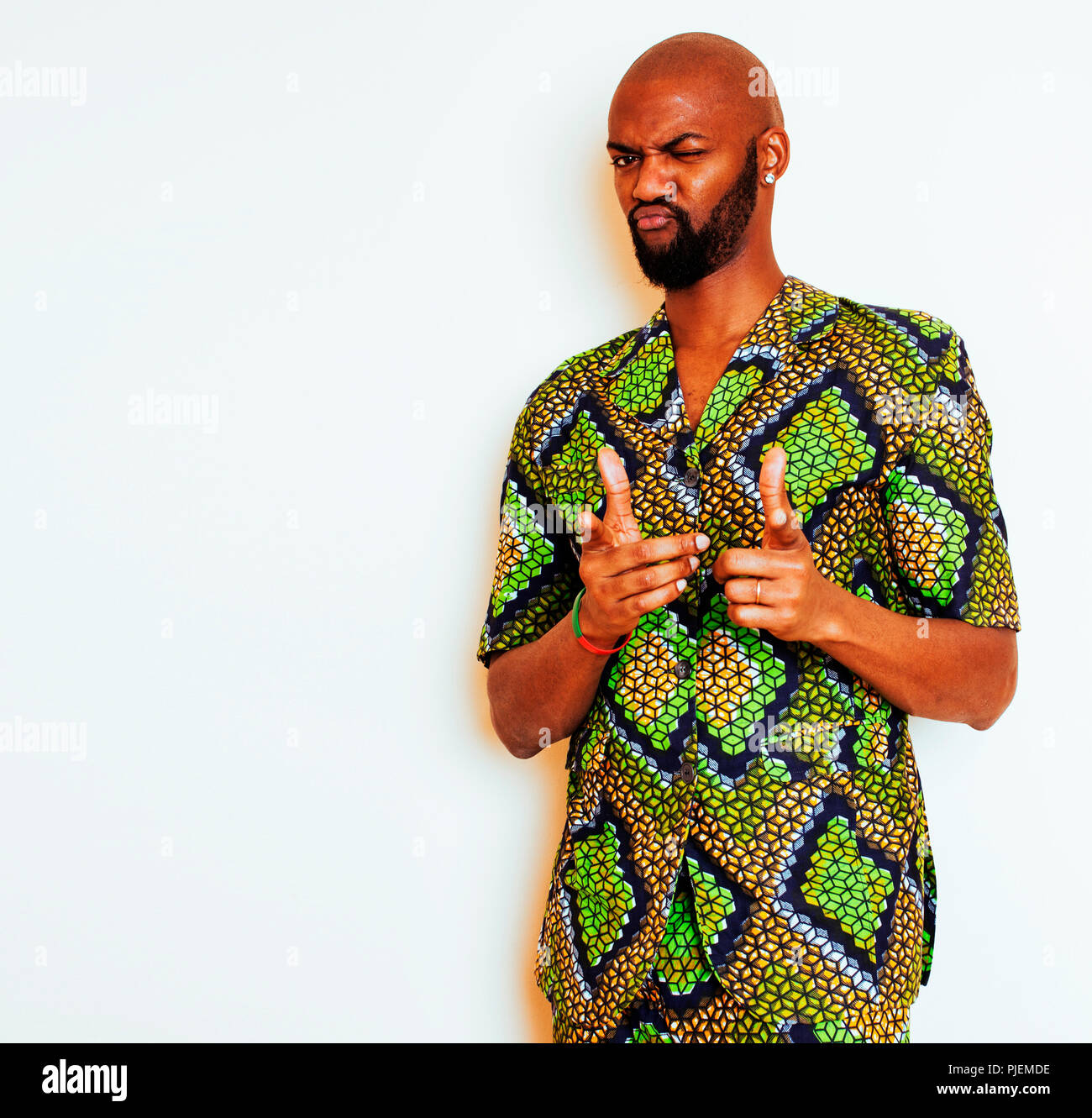 portrait of young handsome african man wearing bright green nati Stock ...