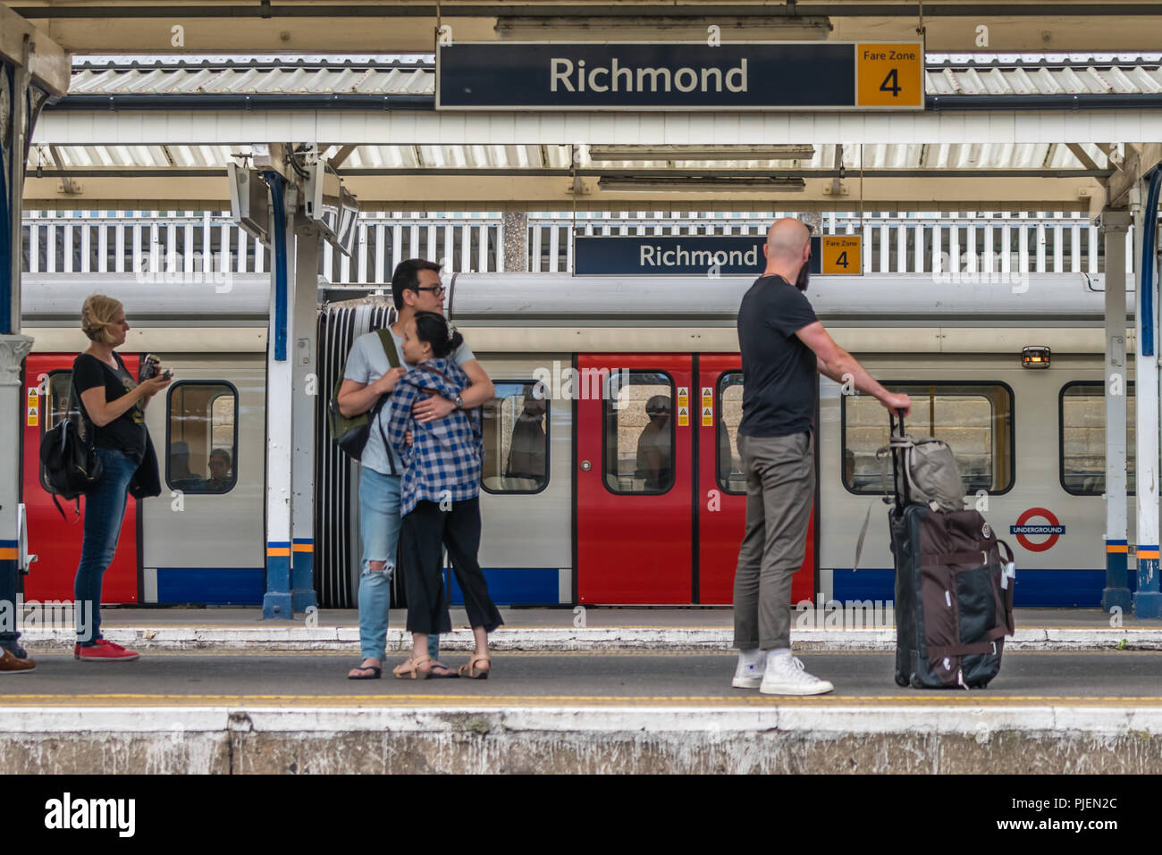 London, England - July 2018 : Commuters waiting for incoming train on ...