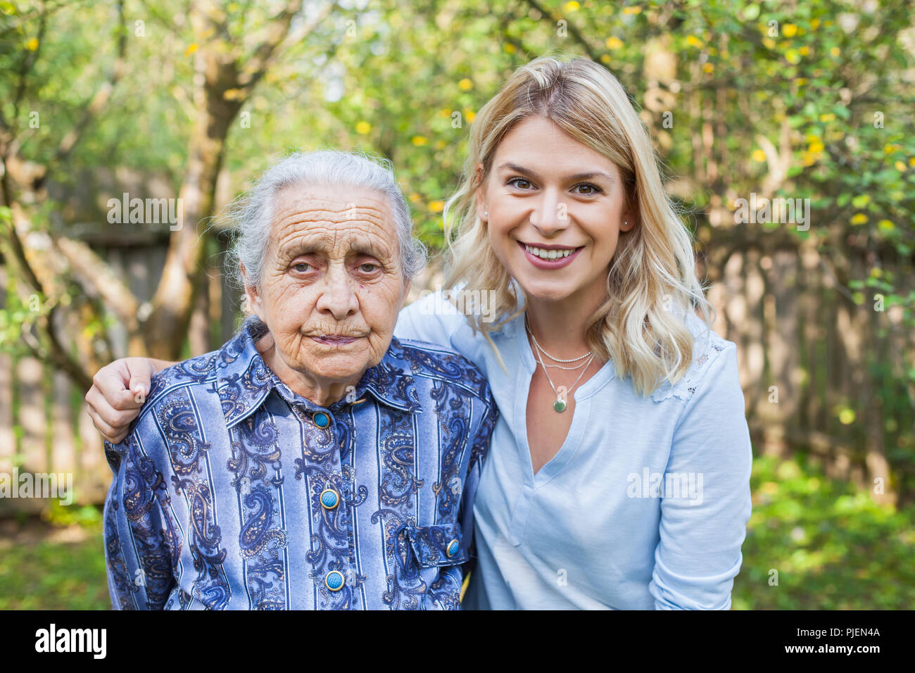 Young patient with carer outside hi-res stock photography and images ...