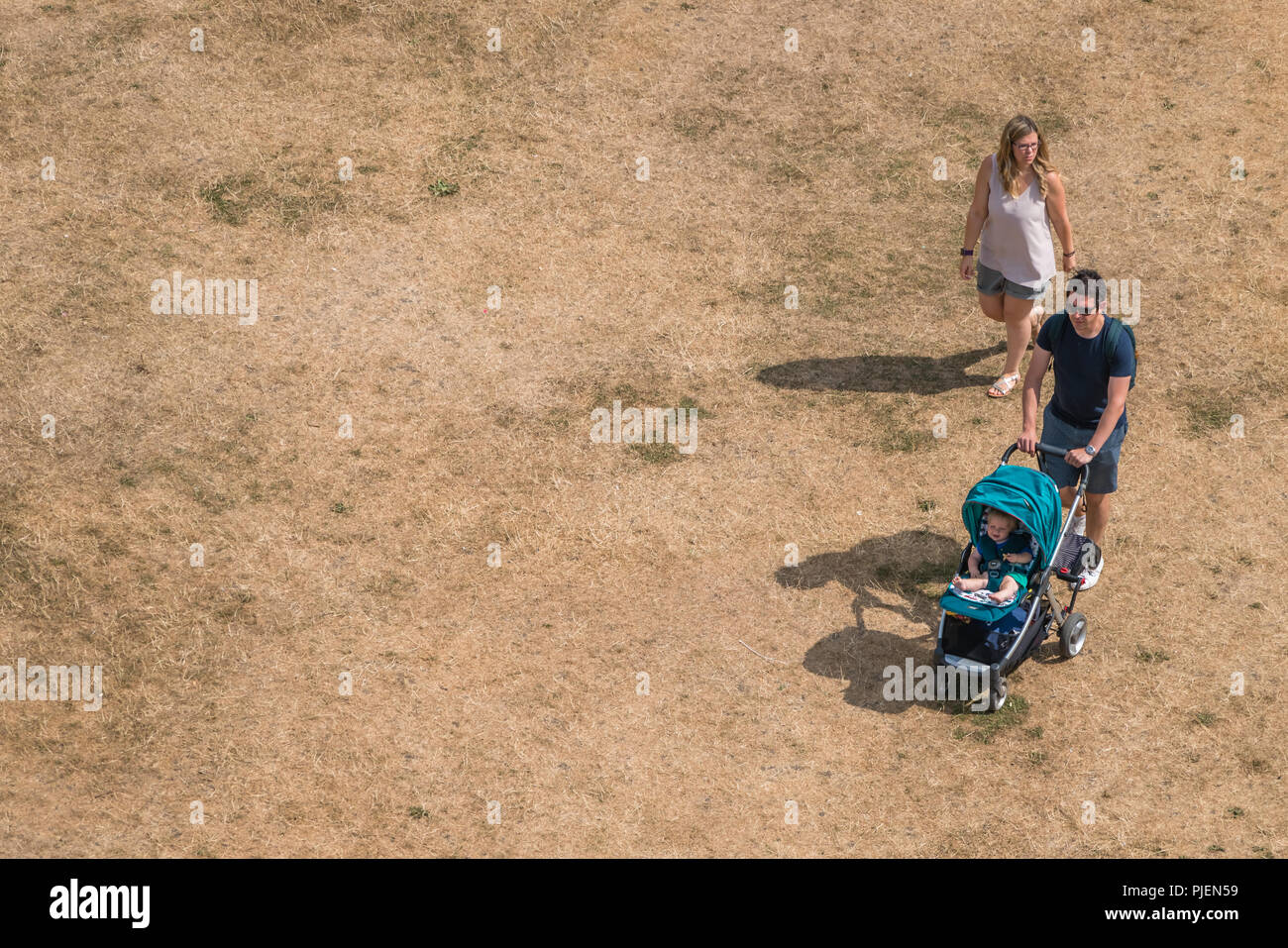 Woman pushing pram in public park hi-res stock photography and images ...