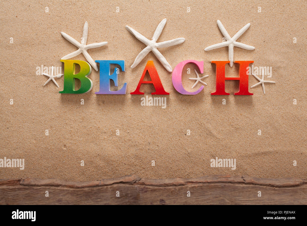 top view of beach written in colorful letters decorate with shellfish ...