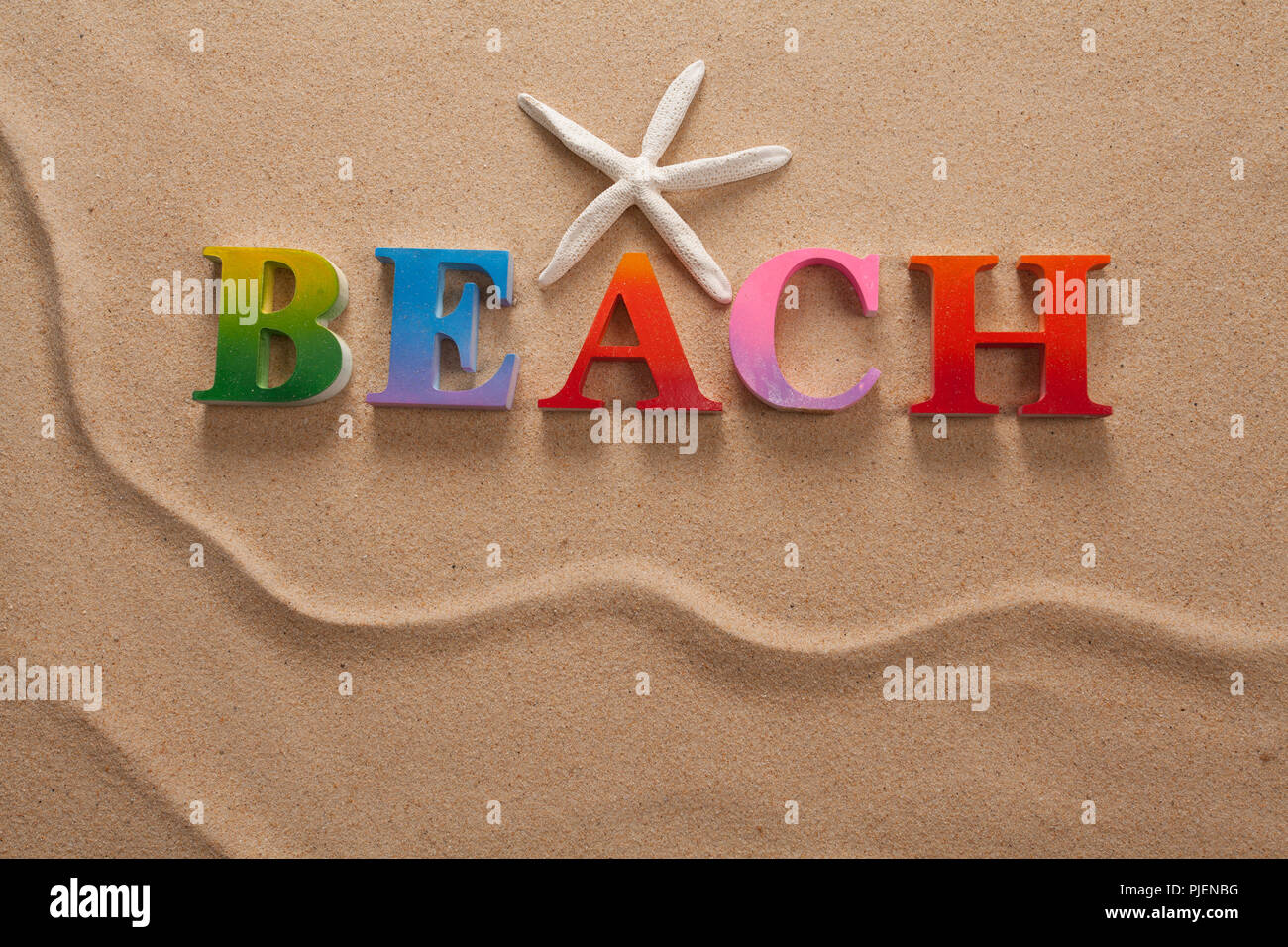 top view of beach written in colorful letters decorate with shellfish ...