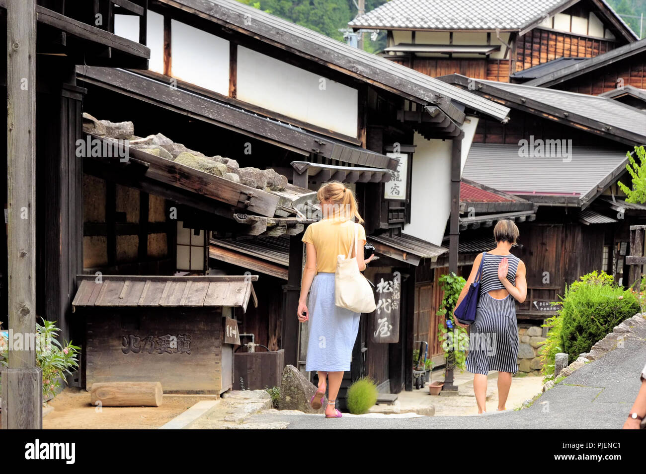 caucasian visitors at Tsumago, an old townscape preserved area in Japan ...